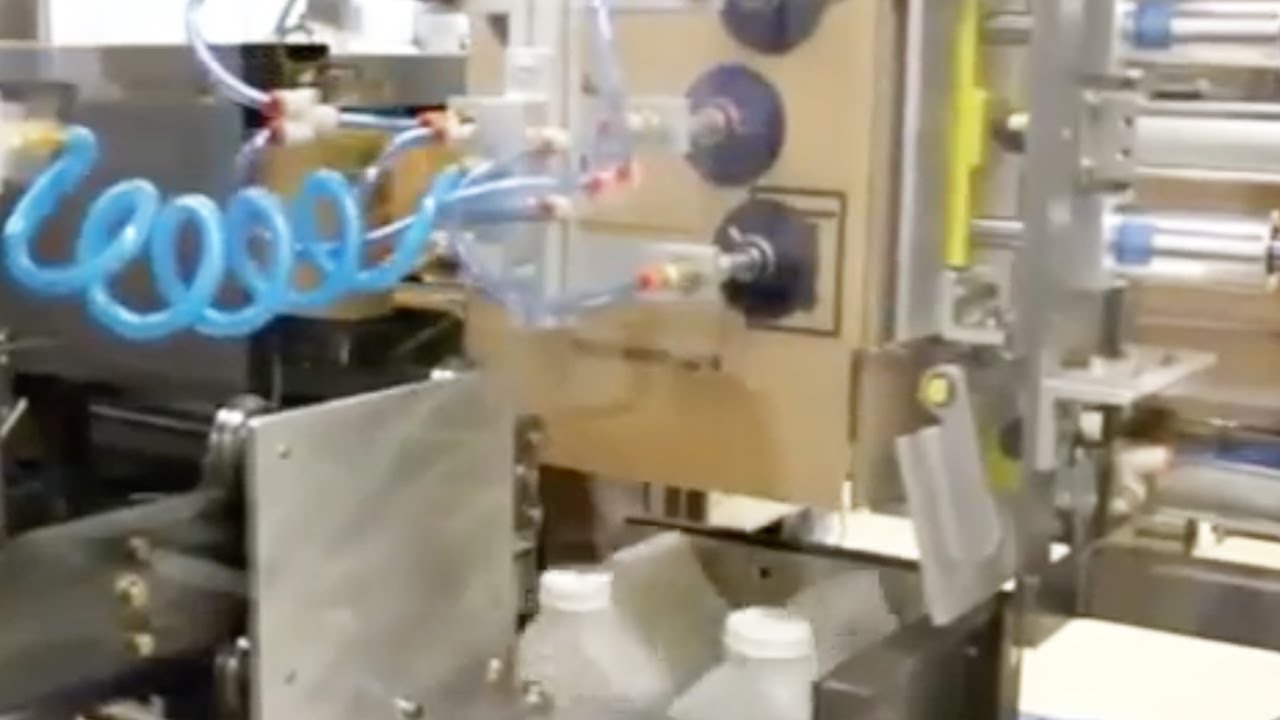 "Revolutionary Liquid Jug Auto Case Packer with Up-Stacking Capability ...